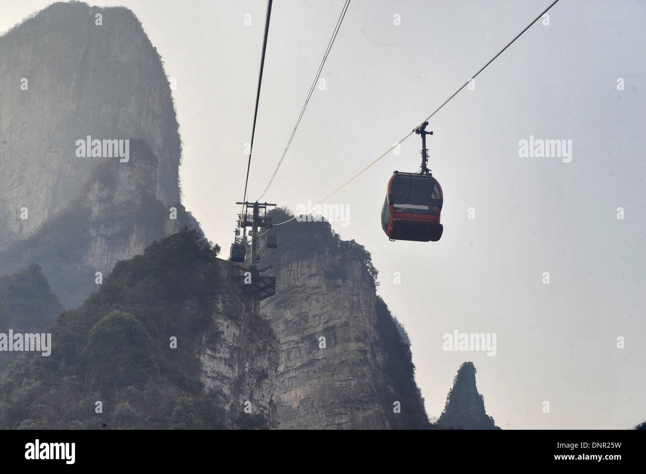 Zhangjiajie, China's Hunan Province. 4th Jan, 2014. People take cable ...