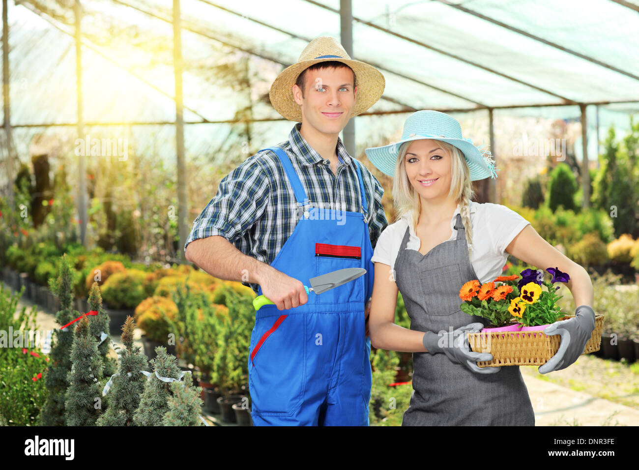 Happy male female gardeners hi-res stock photography and images - Alamy