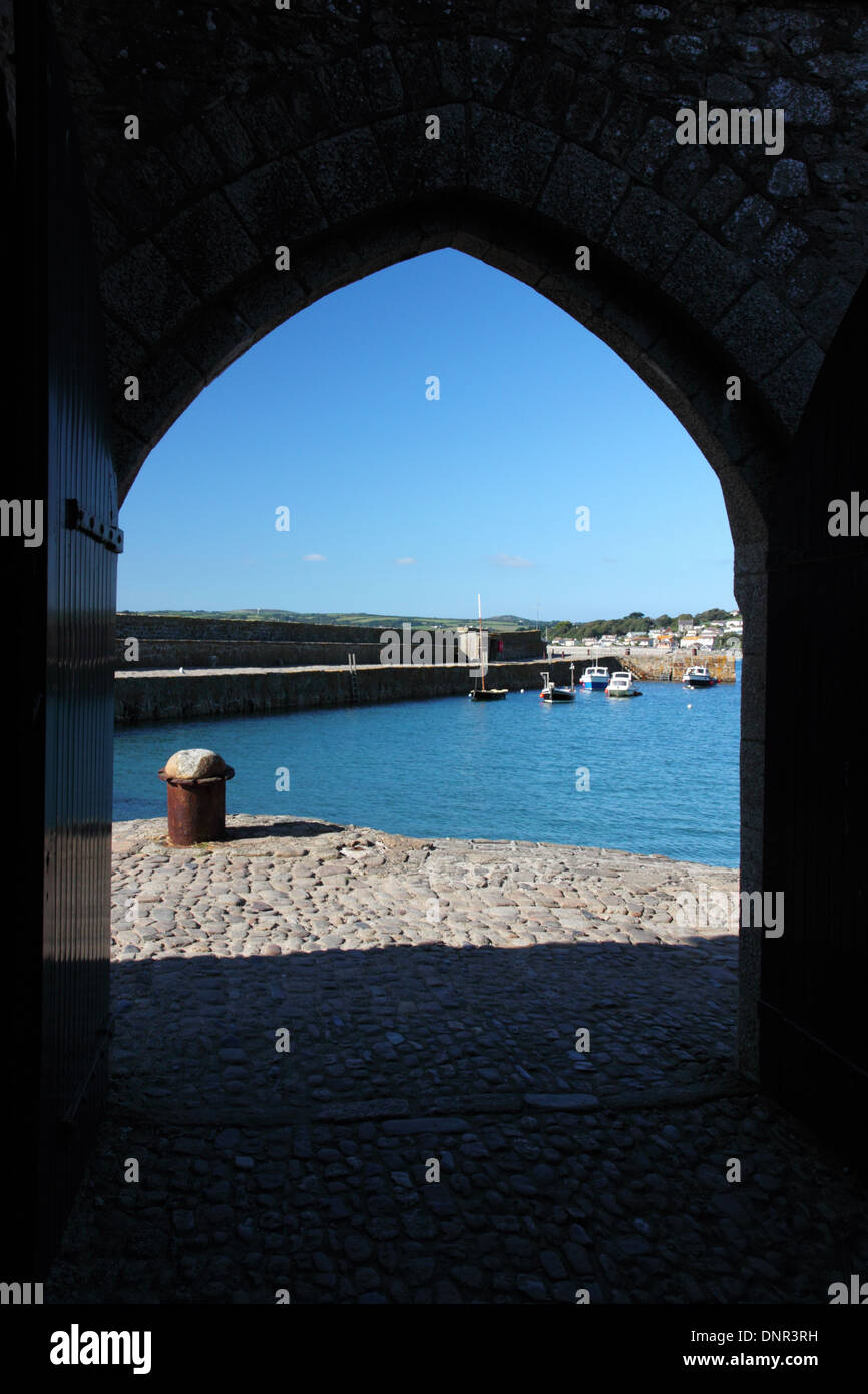 A harbour seen through a Norman-style arch Stock Photo - Alamy