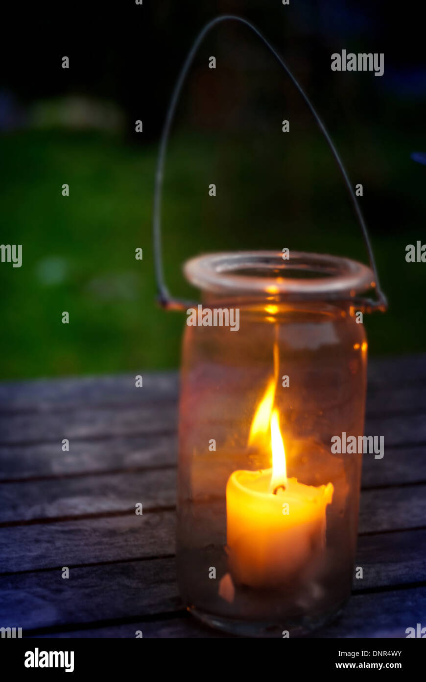 Candle in a jar / Barbecue lighting Stock Photo - Alamy