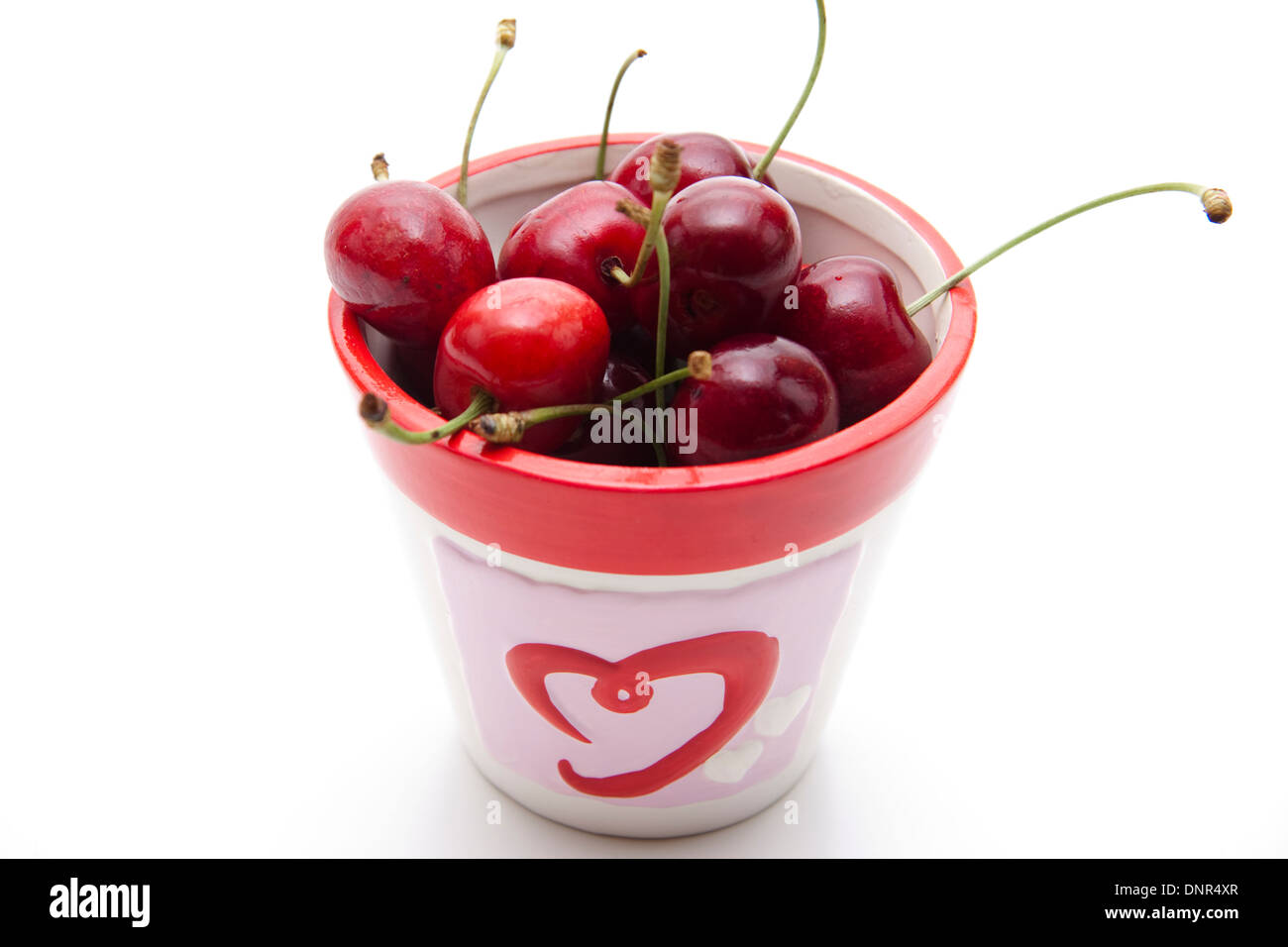 Red cherries with ceramic pot Stock Photo - Alamy