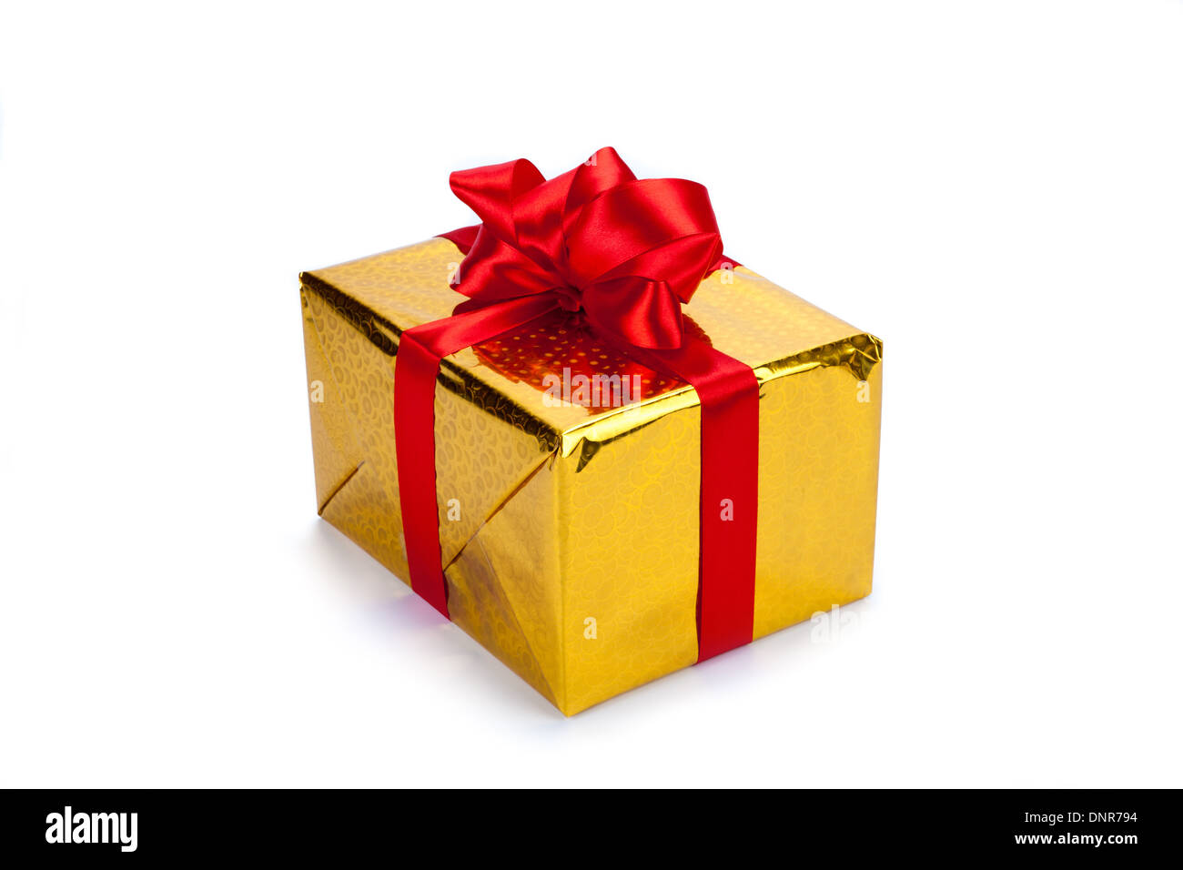Gold gift box on white background Stock Photo - Alamy