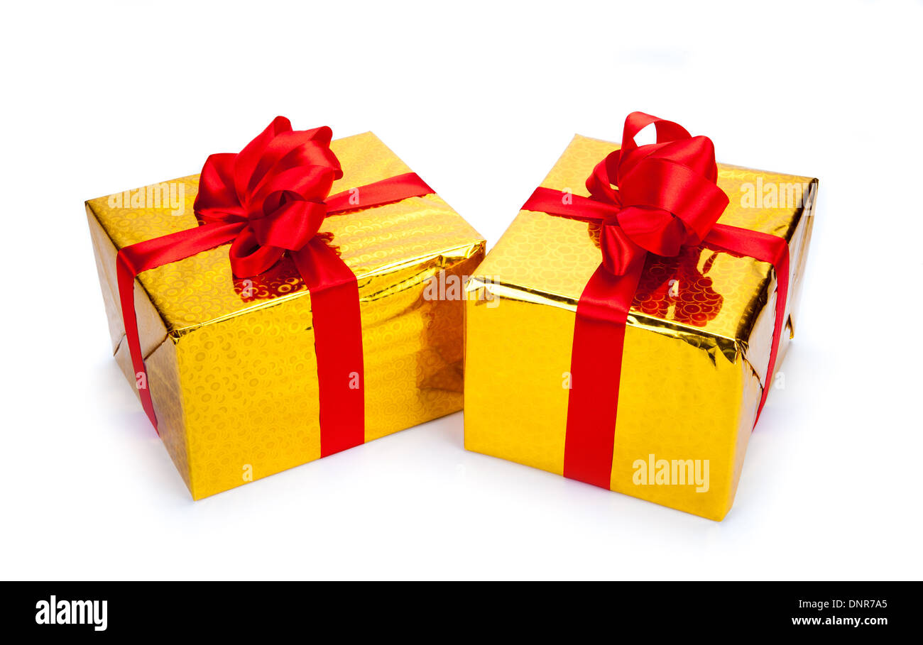 Two gold gift boxes on white background Stock Photo - Alamy