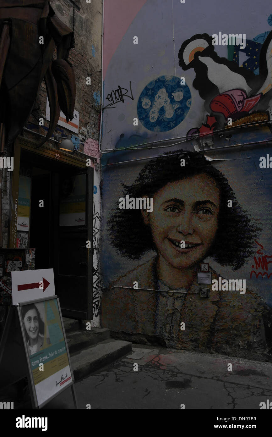 Portrait of large smiling image Ann Frank painted on wall at the ...