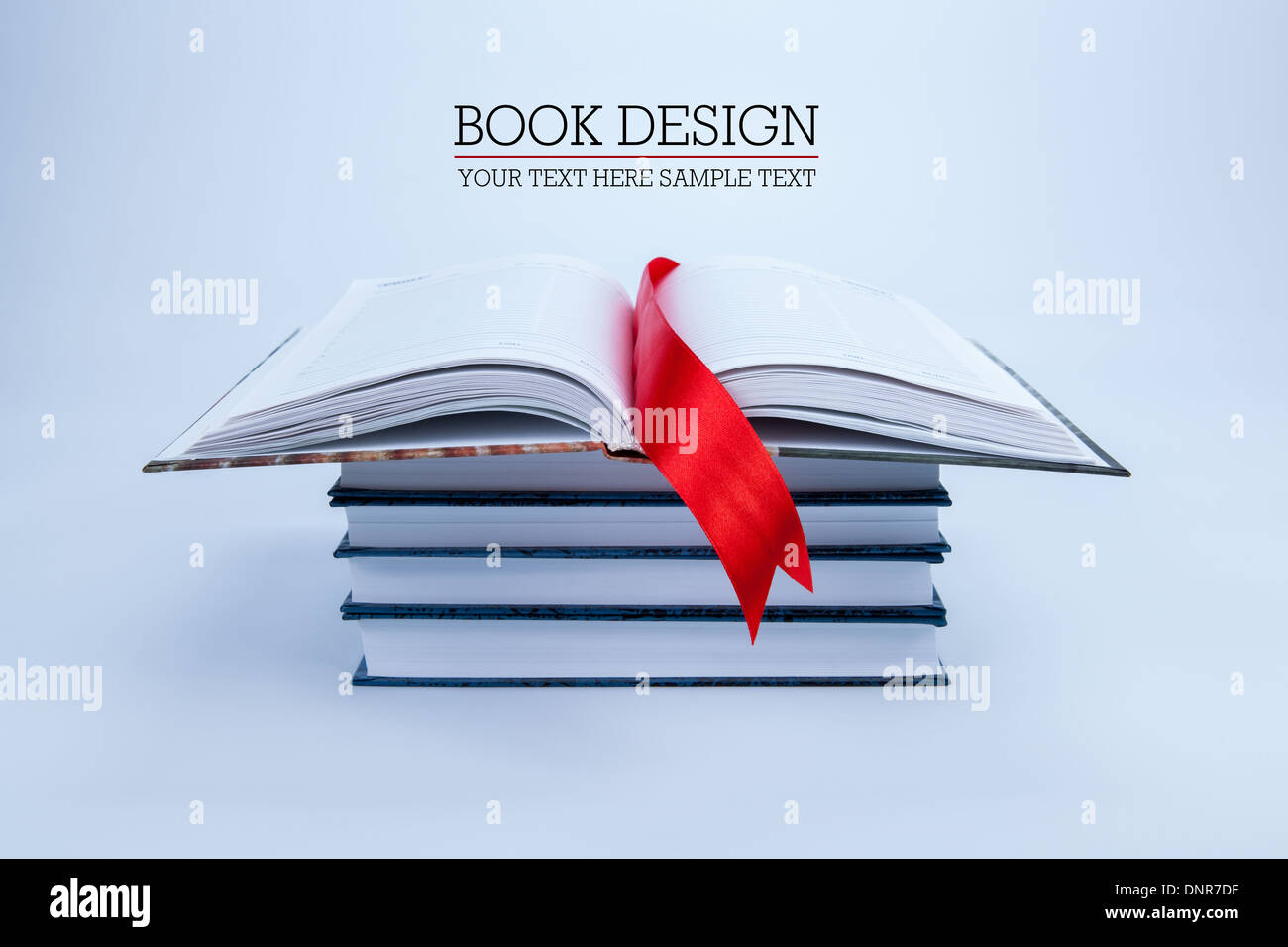 open book on a pile of books isolated Stock Photo - Alamy