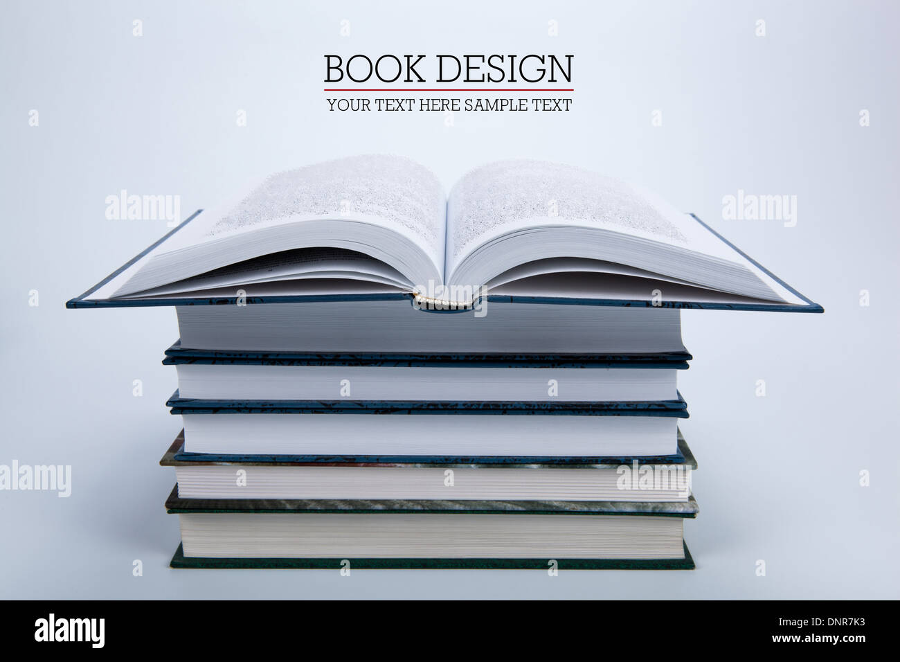 open book on a pile of books isolated Stock Photo - Alamy