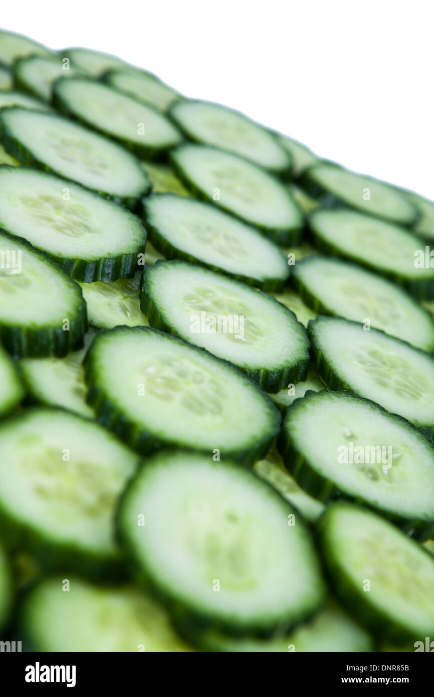 stack of sliced cucumbers on white background Stock Photo - Alamy