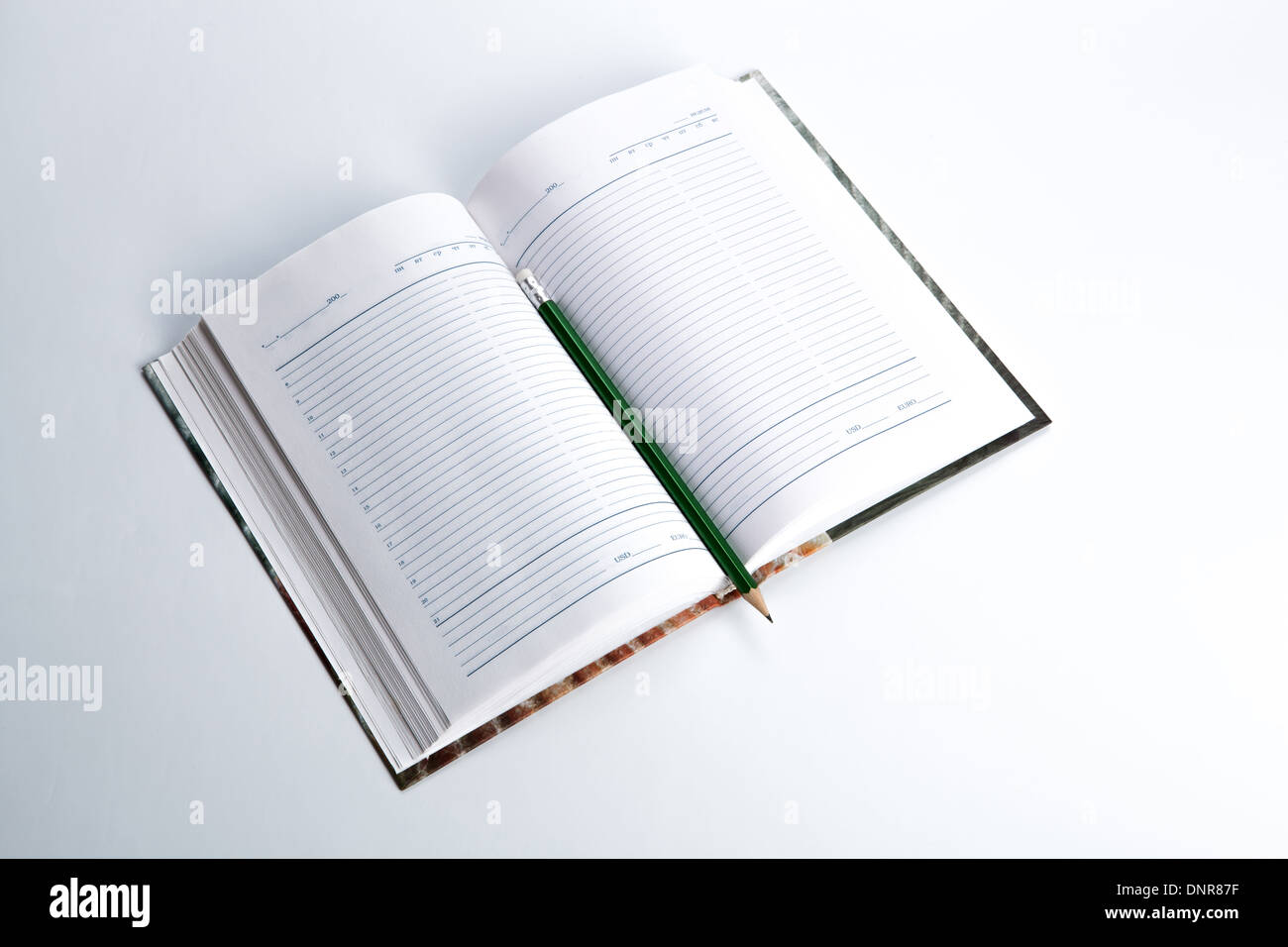 open diary with shiny pencil Stock Photo - Alamy