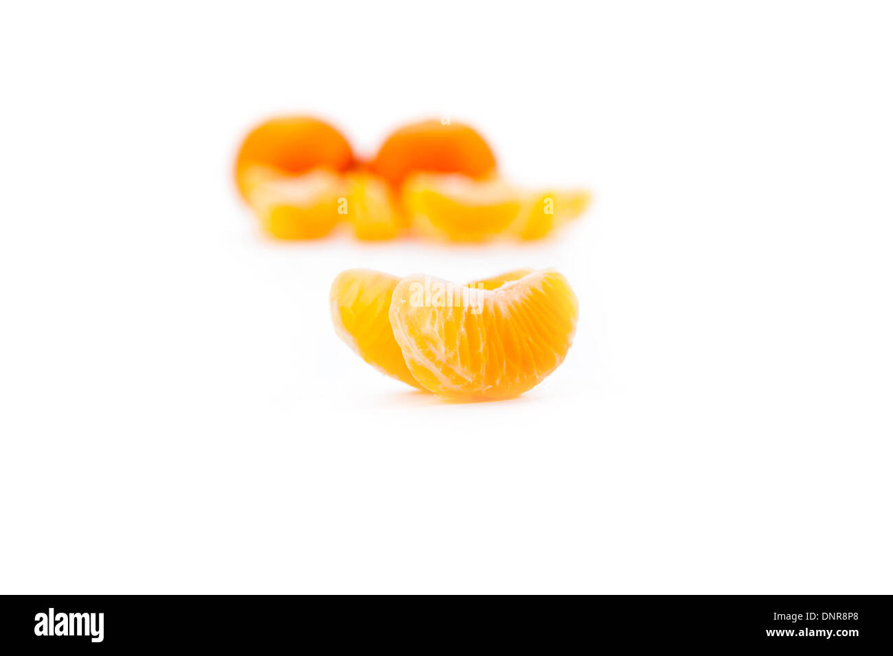 Two orange mandarin slices hi-res stock photography and images - Alamy