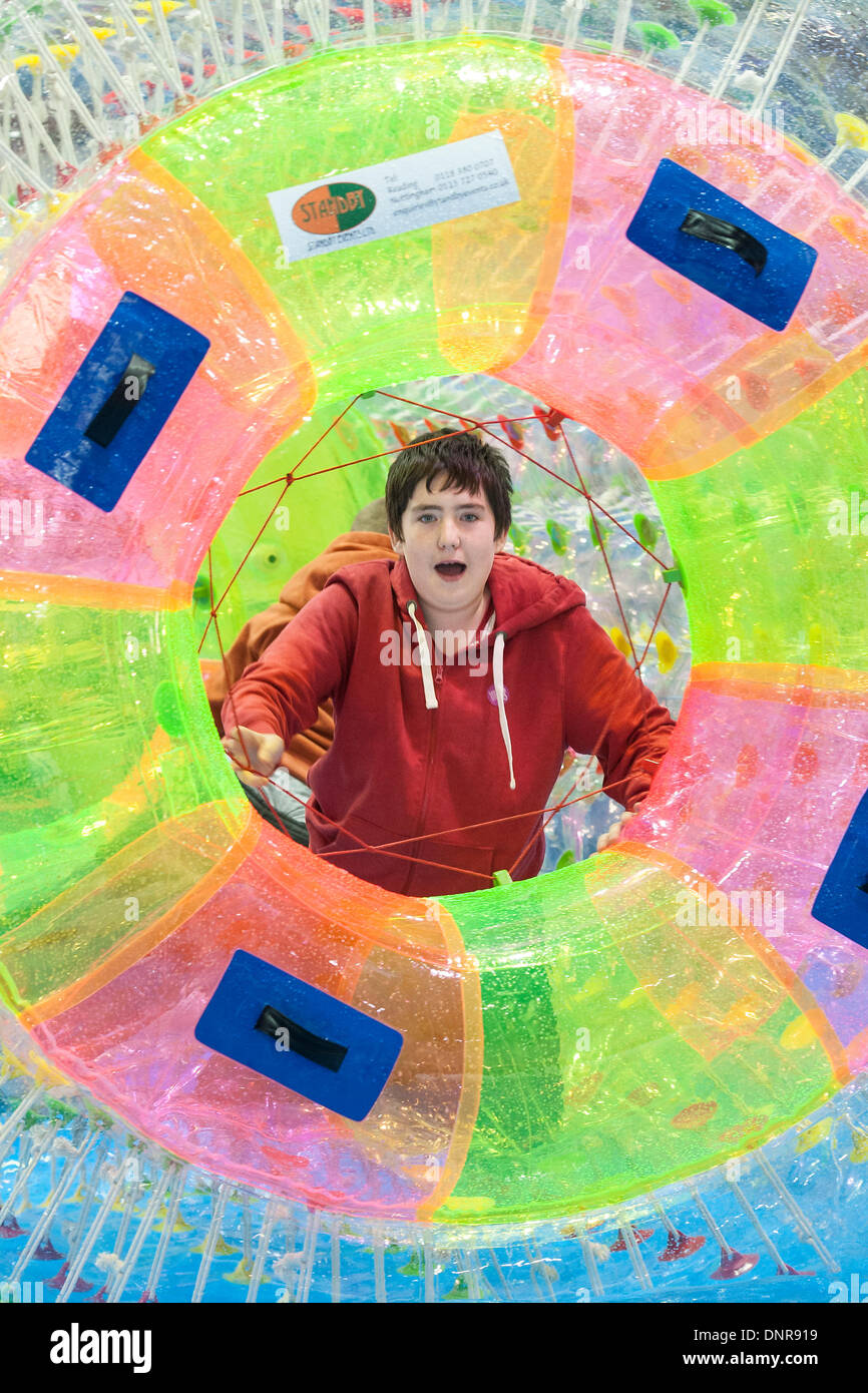 London, UK. 04th Jan, 2014. Children enjoy Zorbing (giant inflatable ...