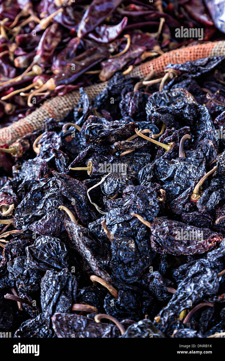 Dried and smoked pasilla chili pepper at Benito Juarez market in Oaxaca ...
