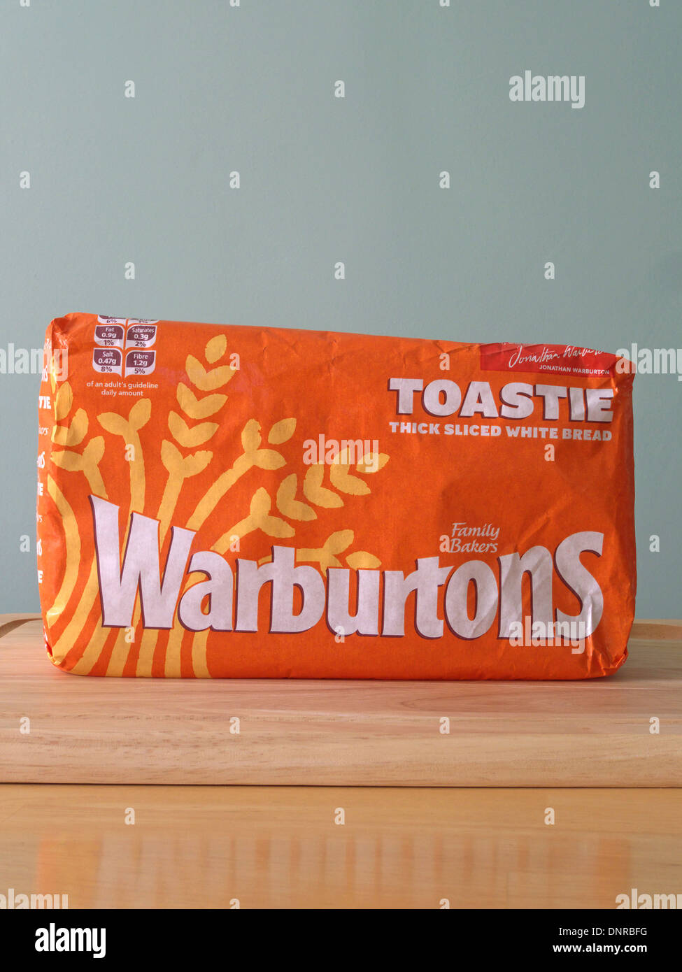 Warburton's Toastie Thick Sliced White Loaf on a Bread Board, UK Stock ...