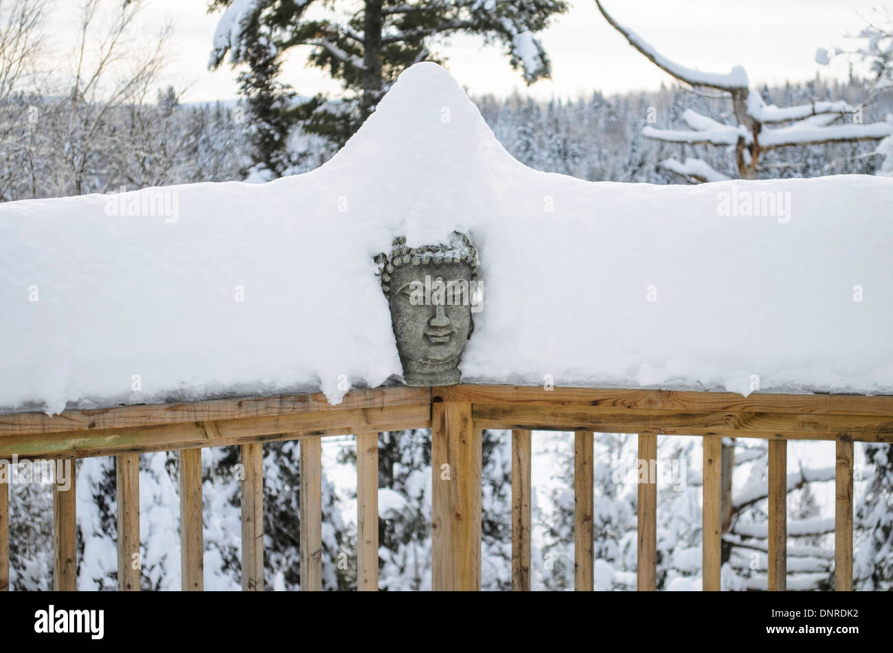 Buddha statue covered in snow Stock Photo - Alamy