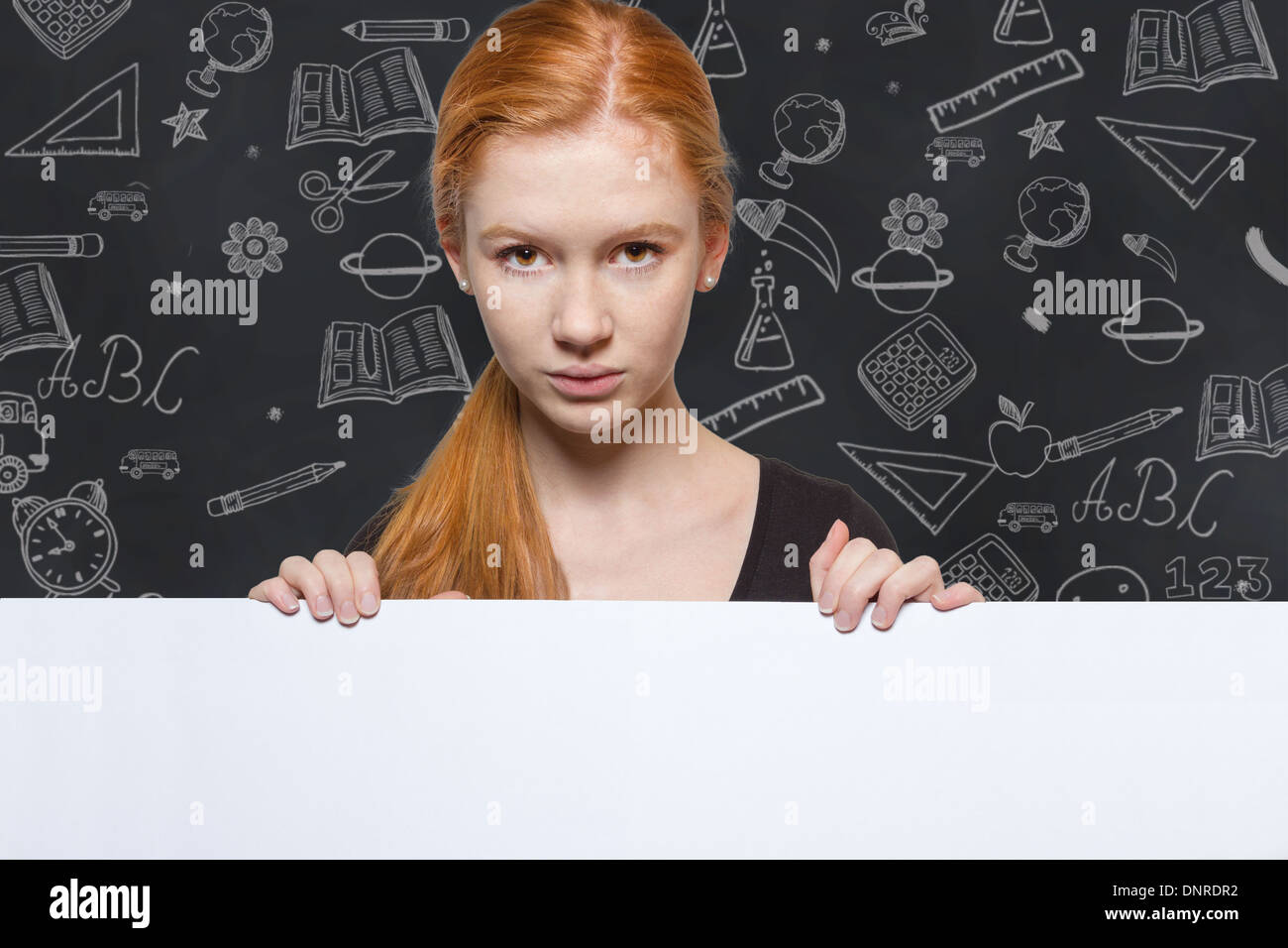 Cute teen girl holding a white sign Stock Photo - Alamy