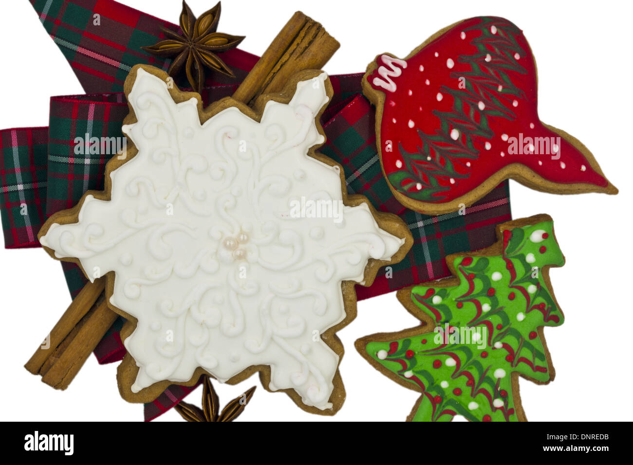 Iced cookies and spices with tartan ribbon isolated on white Stock ...