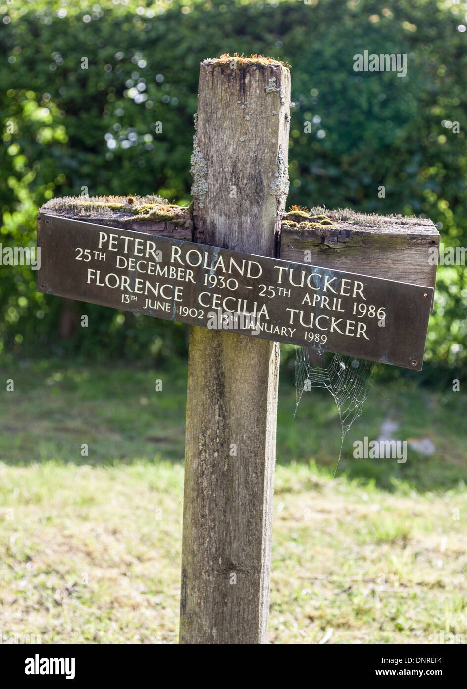 Neglected, decaying wooden grave cross memorial in churchyard of St ...