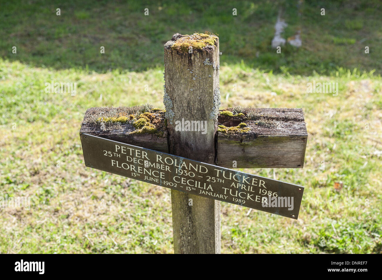 Neglected, decaying wooden grave cross memorial in churchyard of St ...