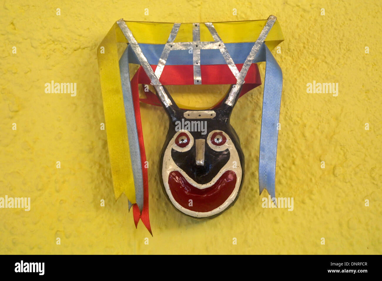 A Chuao devil dancer´s mask decorated with the Venezuelan flag ...