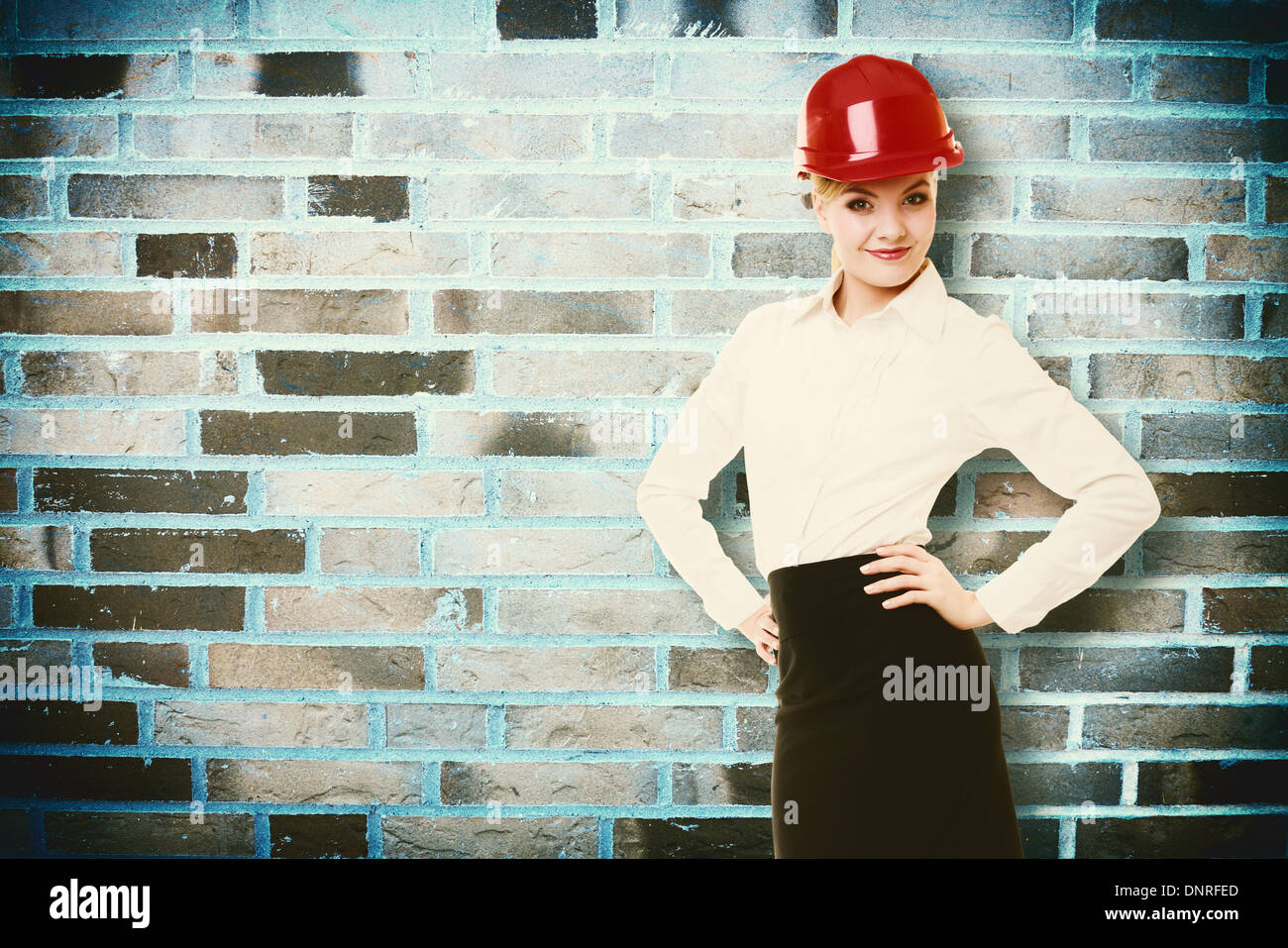 Female engineer woman architect in red safety helmet Stock Photo - Alamy