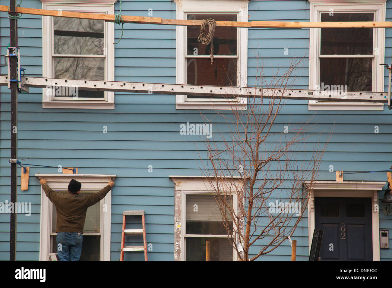 construction man working on house Stock Photo - Alamy