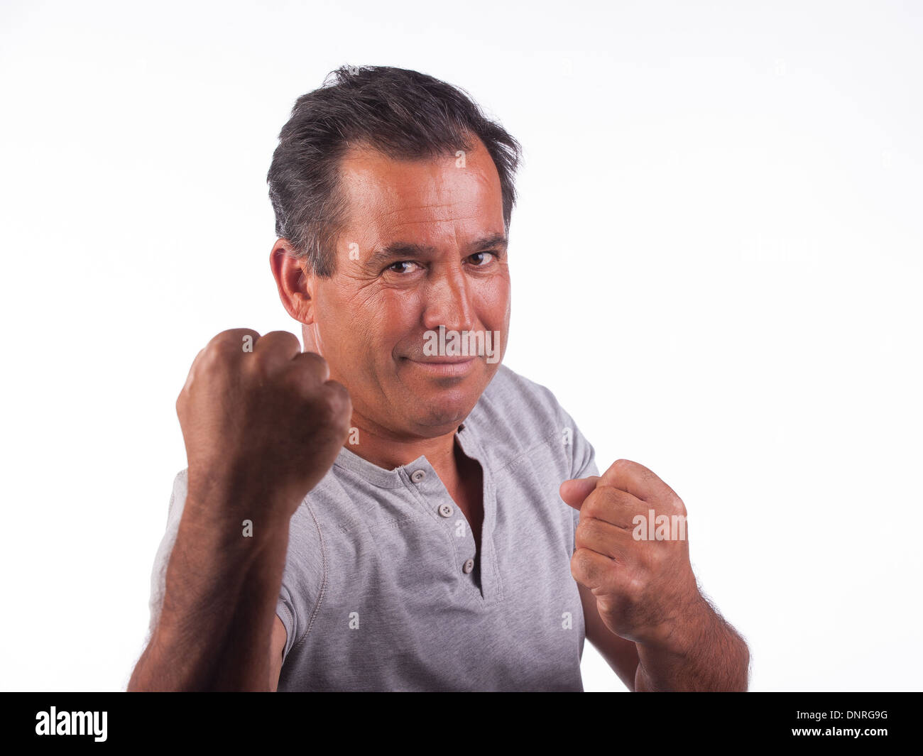 man smiling infighting position Stock Photo - Alamy