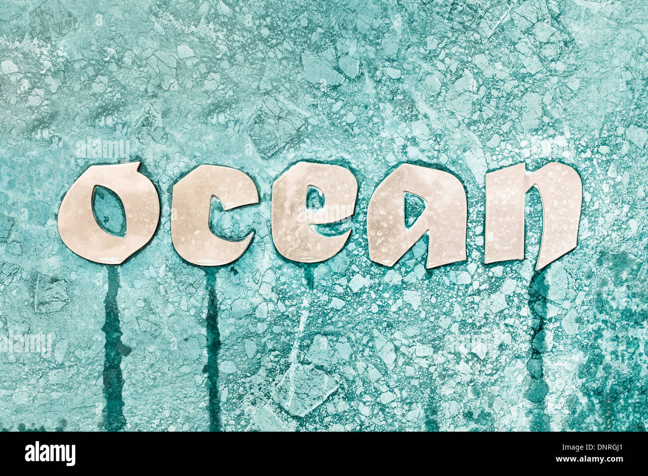 Ocean sign with metallic letters in cold blue tones Stock Photo - Alamy