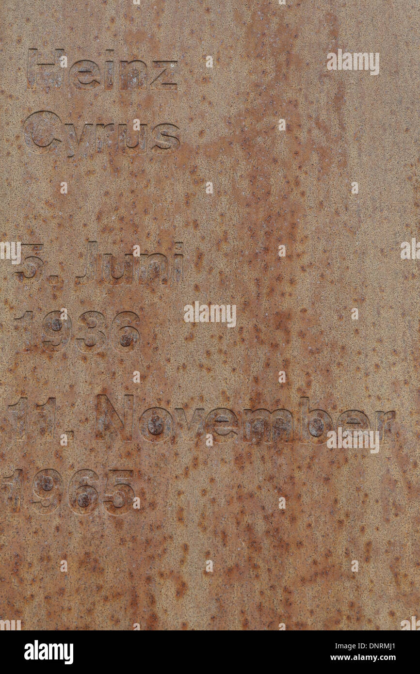 Name and dates of victim Heinz Cyrus inscribed on back of brown metal ...