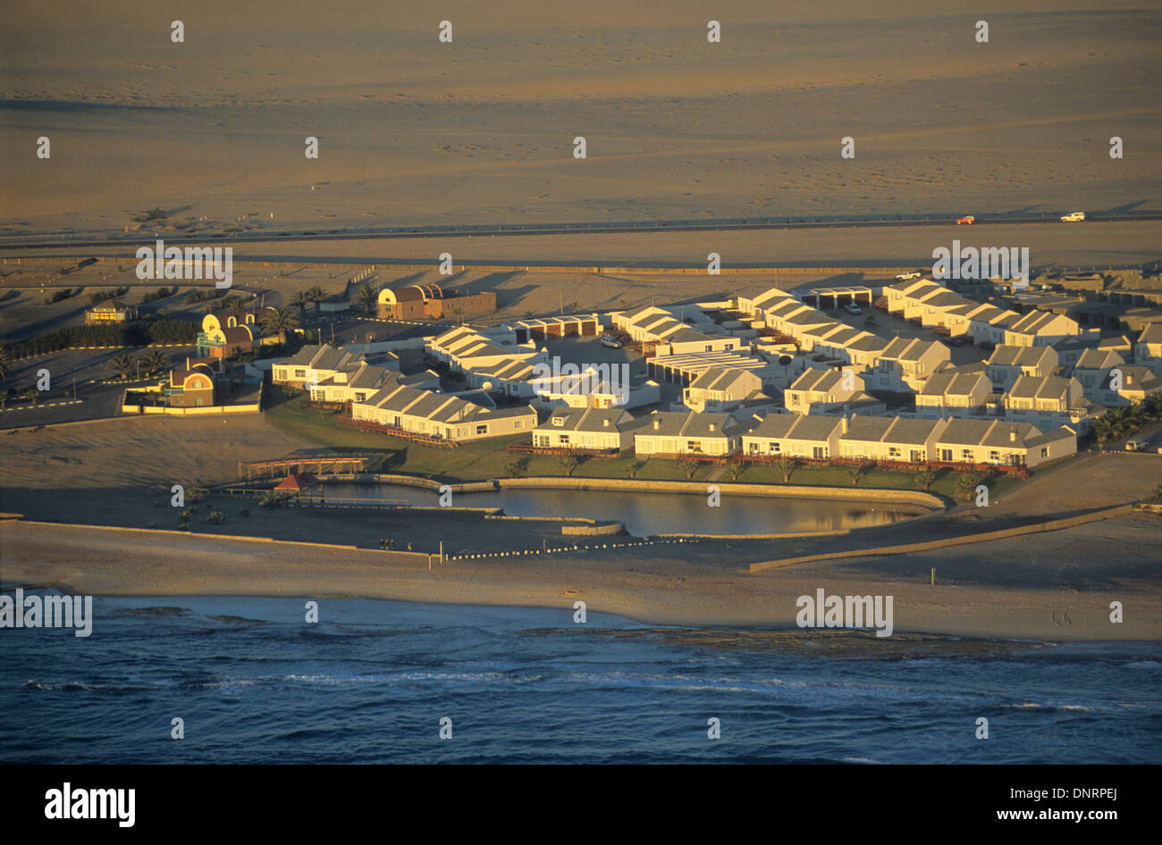 Aerial view of Dolfynstrand resort on Atlantic coast and Namib desert ...