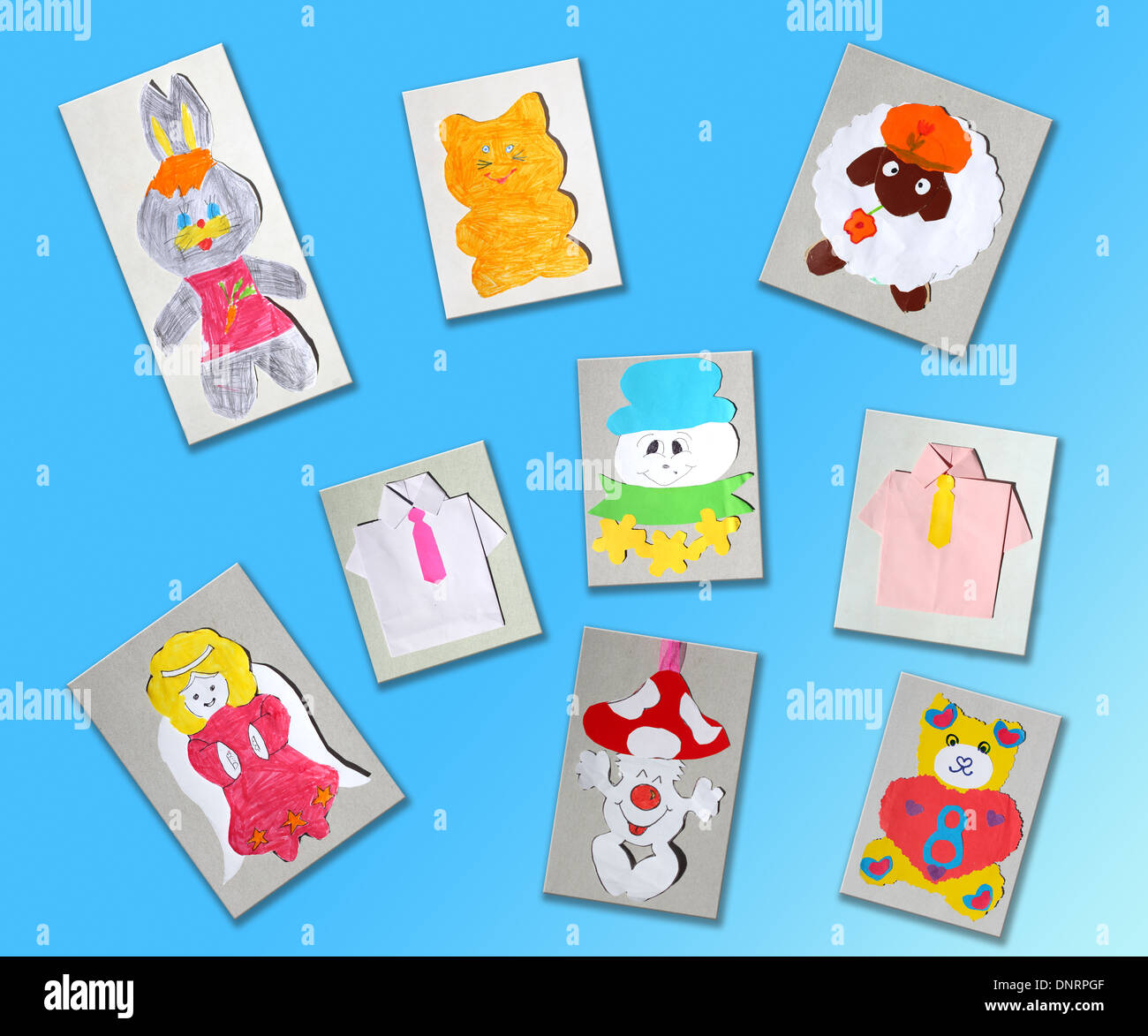 many different children's drawings on the blue background Stock Photo ...