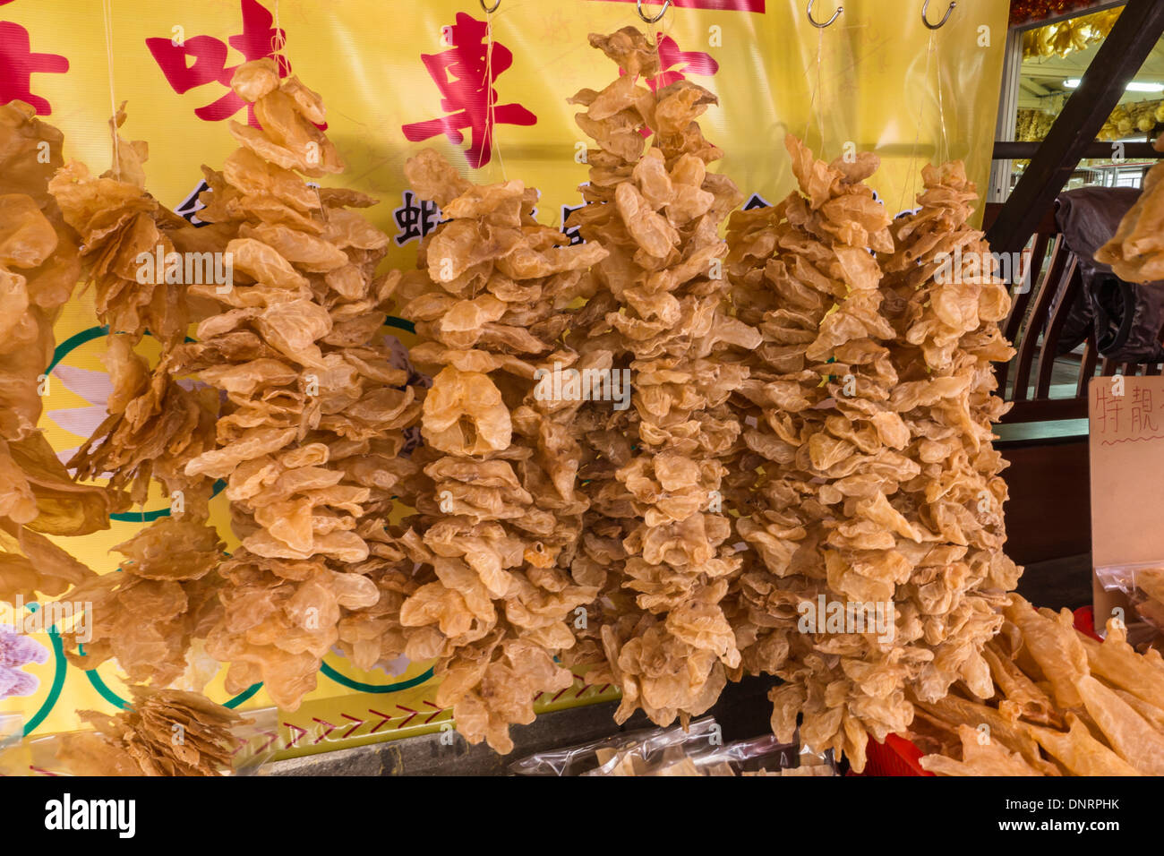 Dried Fish Hanging by a Thread, Hong Kong, China Stock Photo - Alamy