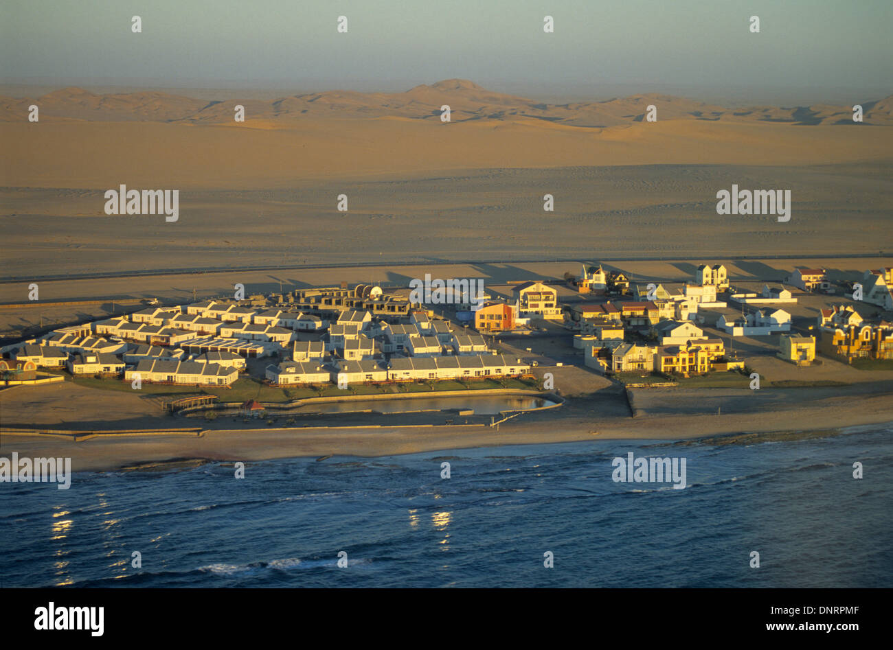 Aerial view of Dolfynstrand resort on Atlantic coast and Namib desert ...