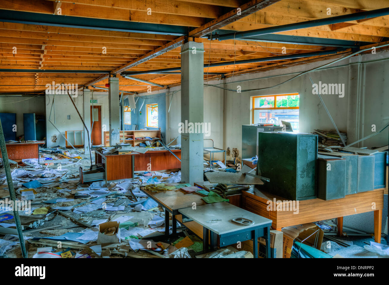 Inside an abandoned office with paper thrown around Stock Photo - Alamy