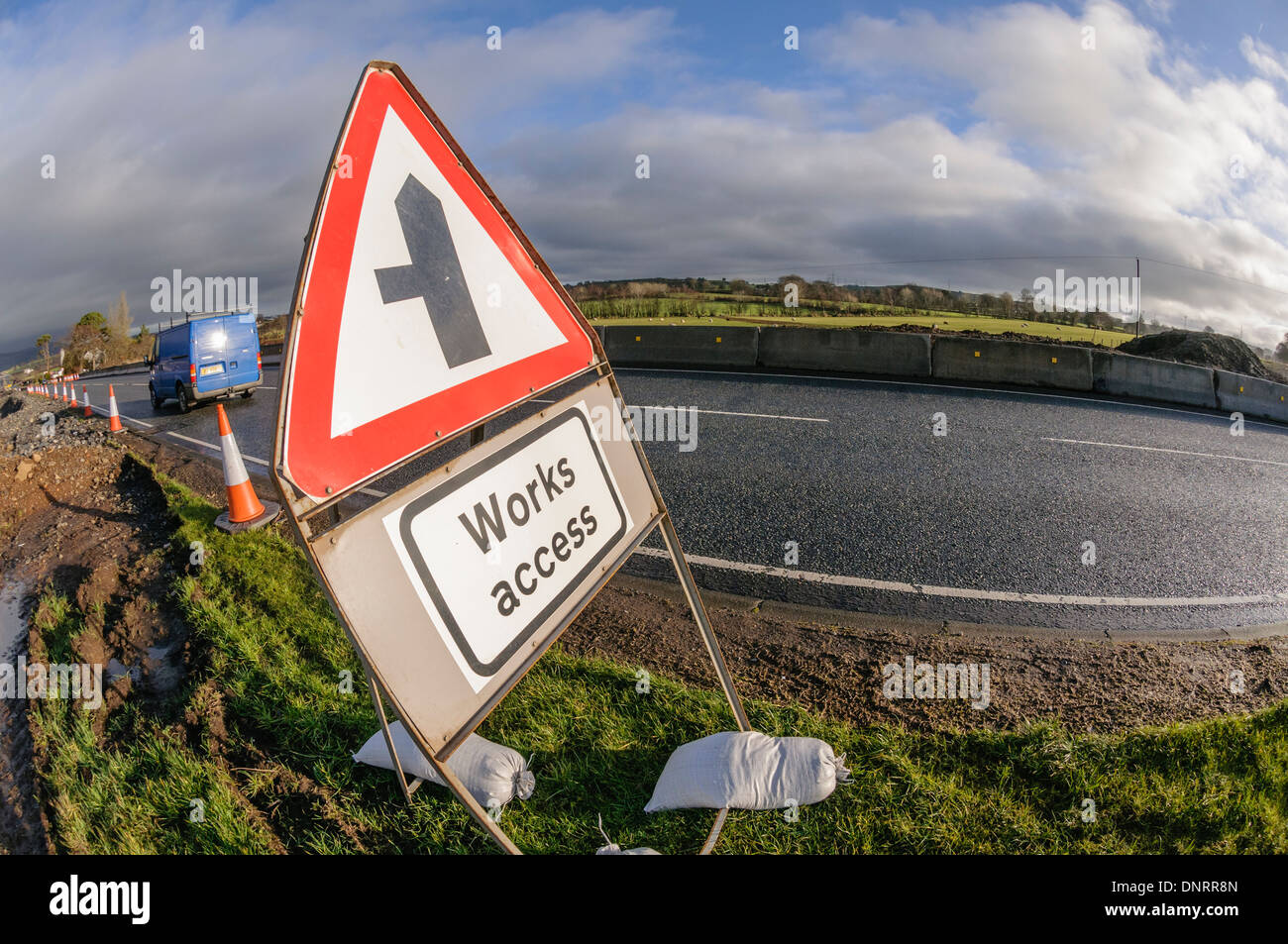 Works Access road sign at a road construction Stock Photo - Alamy
