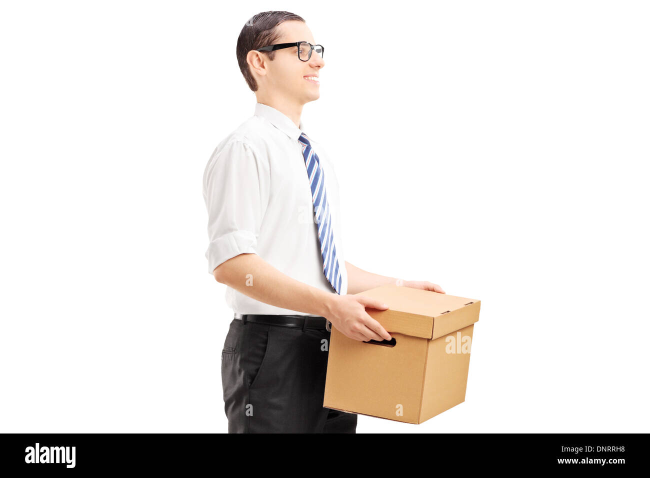Smiling young man walking with a paper box in his hands Stock Photo - Alamy