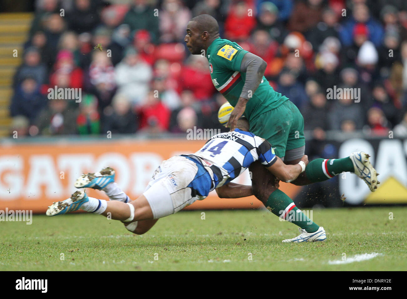 Leicester, UK. 05th Jan, 2014. Miles Benjamin (Tigers) is tackled by ...