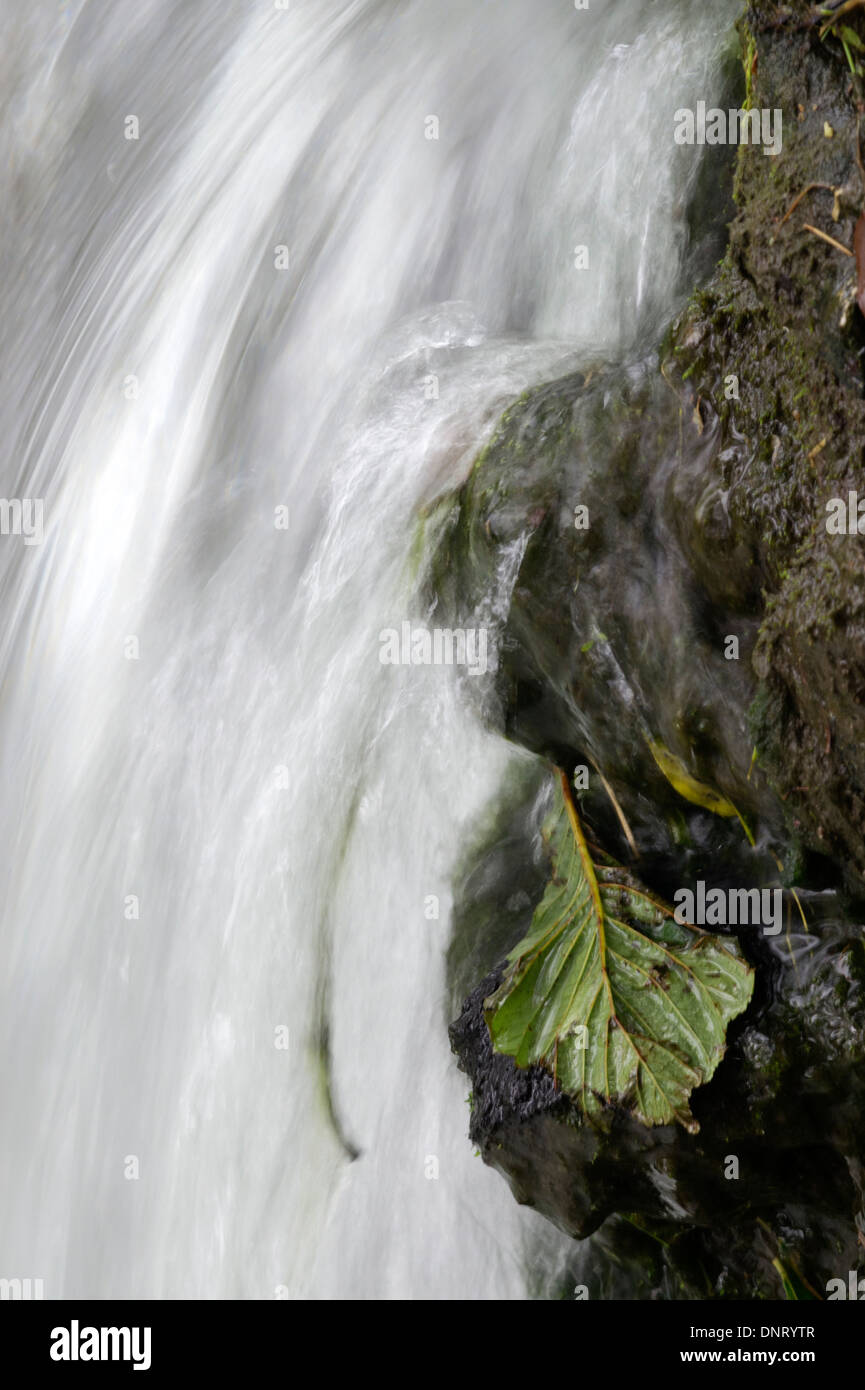 Water falling over rocks Stock Photo - Alamy