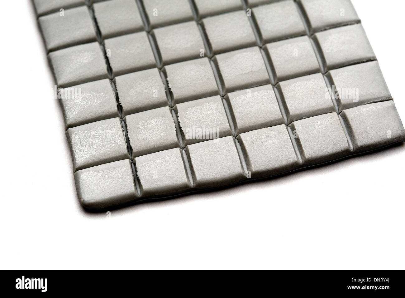 pre cut squares of power tack reusable adhesive Stock Photo - Alamy