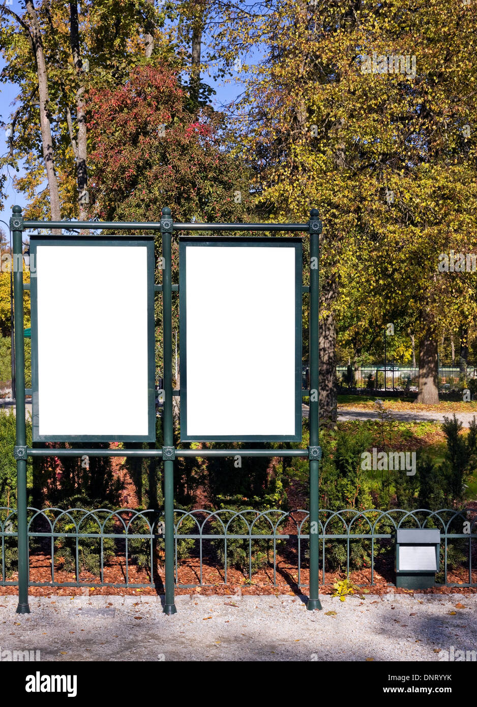 Old retro style iron billboards in autumn city park. Sunny day. Mass ...
