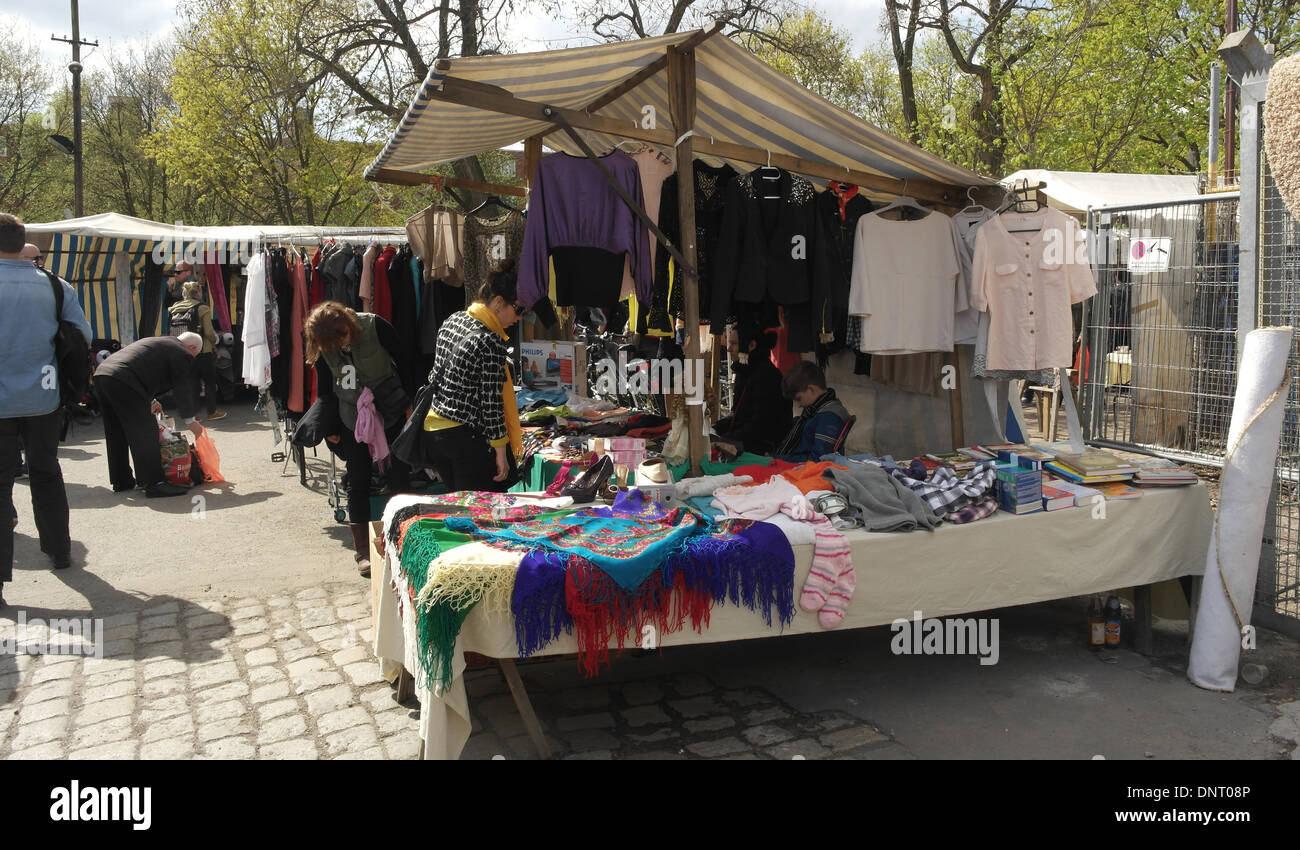 Lady woman caucasian 20s 30s standing looking clothes stall centre mid ...