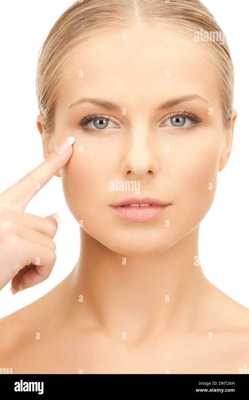 beautiful woman pointing to cheek Stock Photo - Alamy