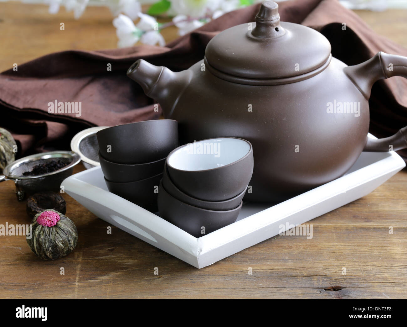 set for a traditional tea drinking (kettle, cups and various grain tea ...