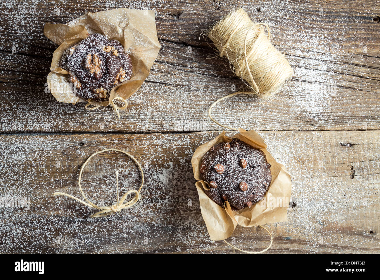 Sweet muffins wrapping with string Stock Photo - Alamy