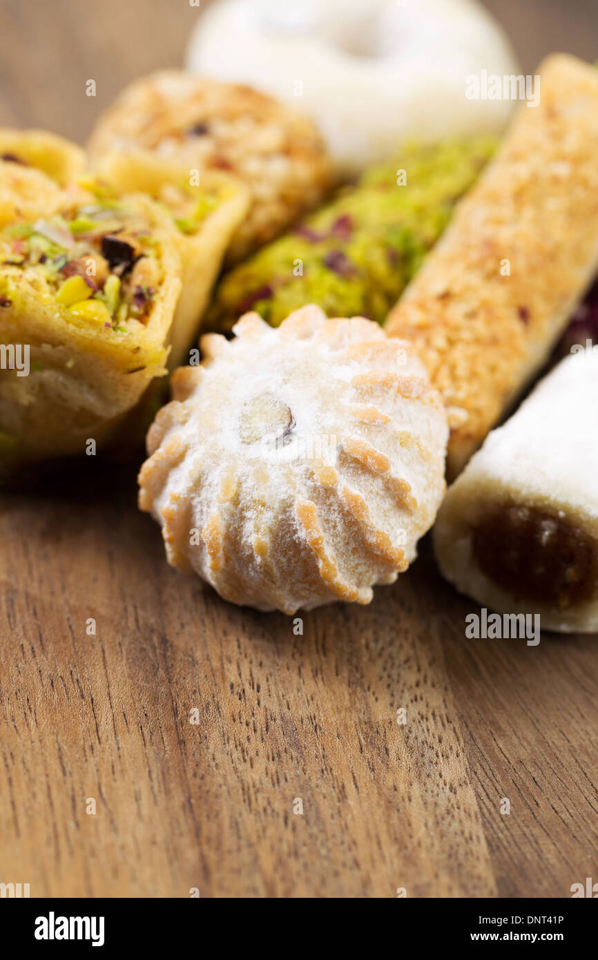 Closeup vertical photo of gourmet cookies, focus on front wheel shaped ...