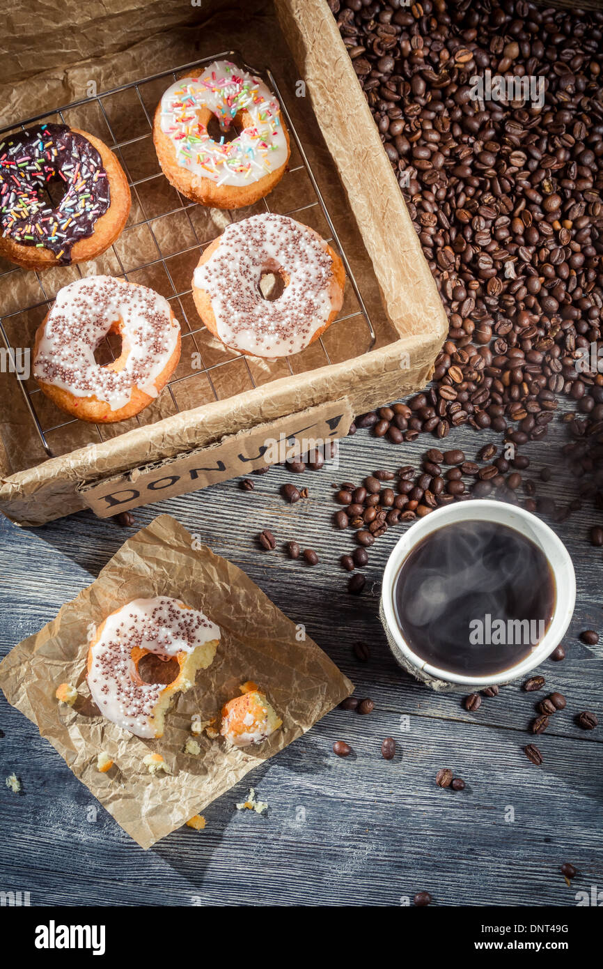Fresh donuts with coffee Stock Photo - Alamy