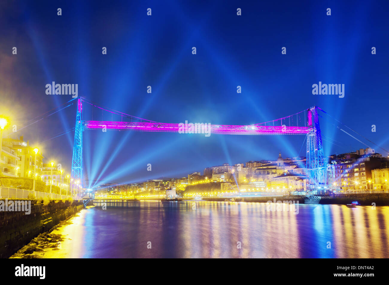 Hanging bridge between Portugalete and Getxo at night with celebration ...