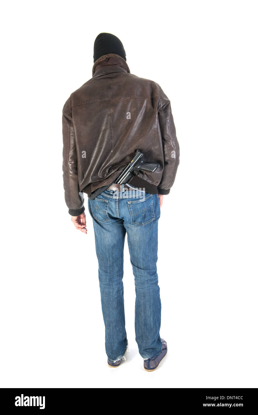 Sniper with gun behind his back in the studio Stock Photo - Alamy