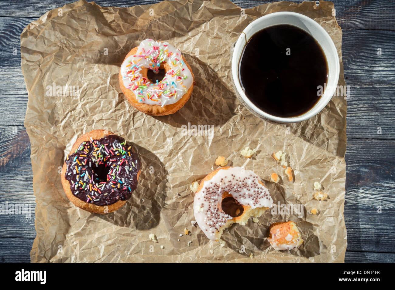 Break at work with coffee and donuts Stock Photo - Alamy