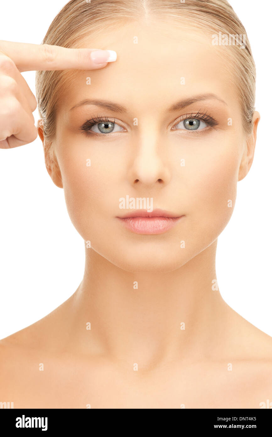 beautiful woman pointing to forehead Stock Photo - Alamy