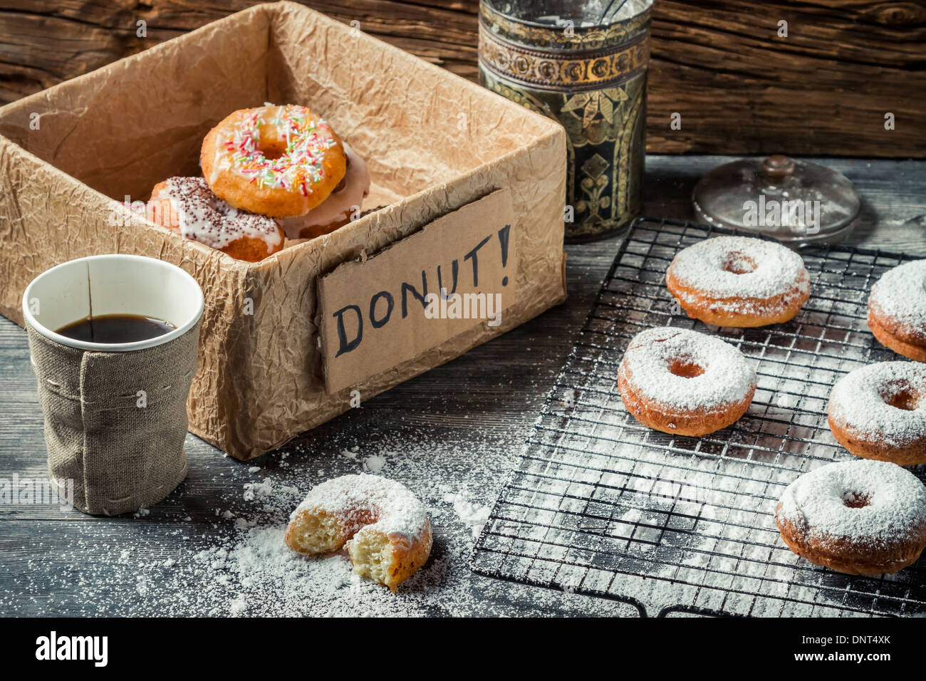 Tasting sweet donuts with powder sugar Stock Photo - Alamy
