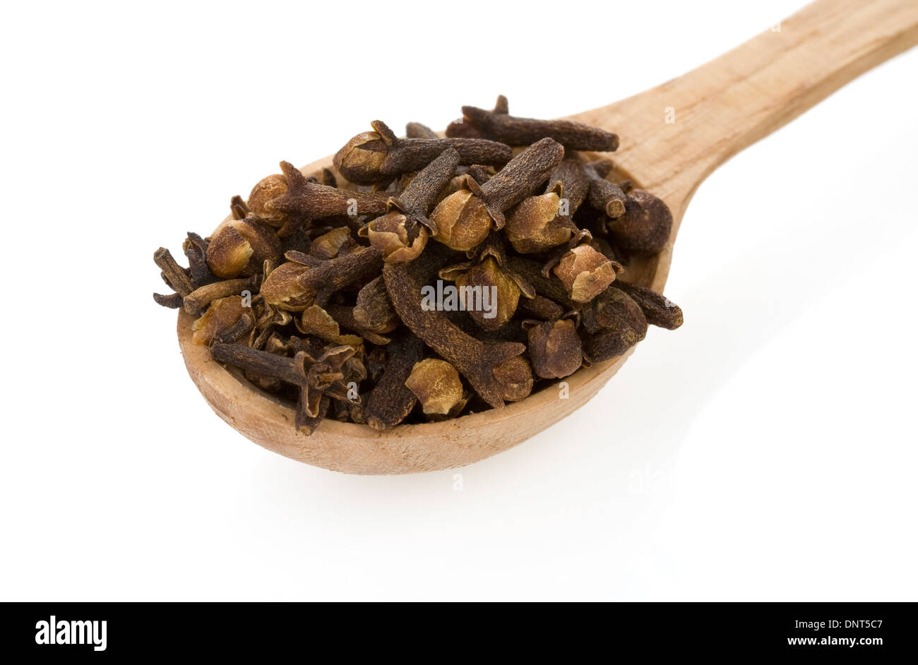 clove spices in spoon isolated on white background Stock Photo - Alamy